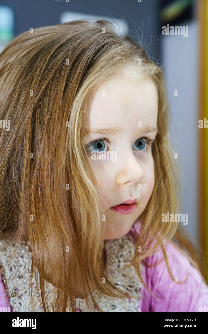 Cute little girl studing to speaking and writing letters at home lesson ...