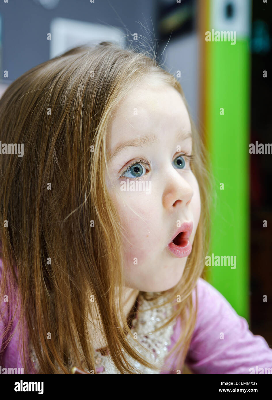 Cute little girl studing to speaking and writing letters at home lesson ...