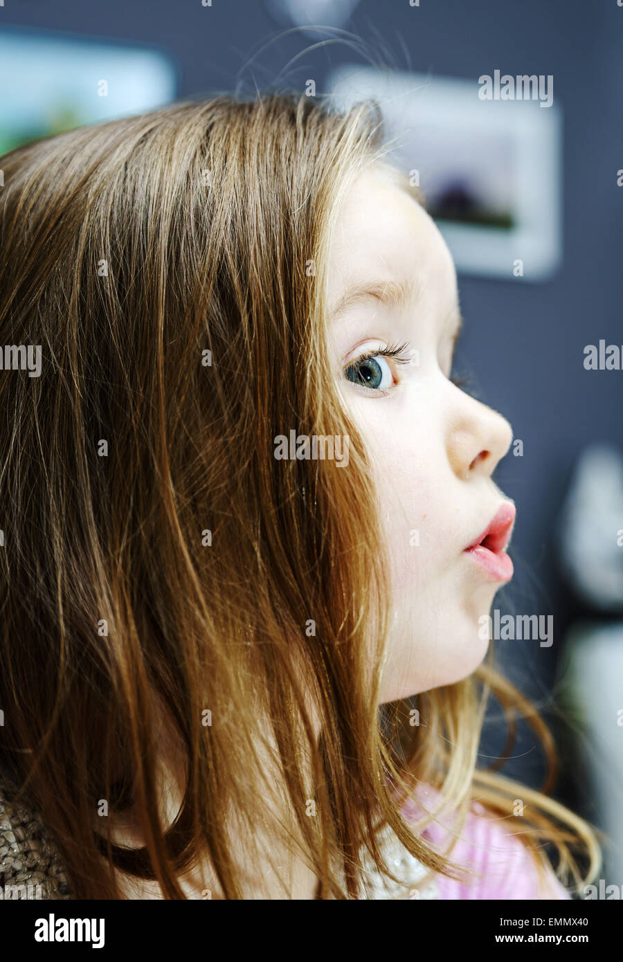 Cute little girl studing to speaking and writing letters at home lesson ...