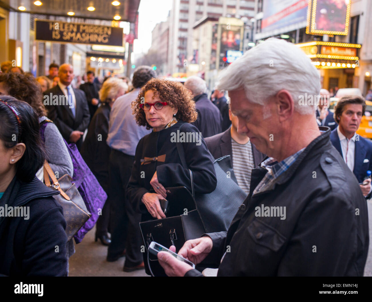 Theater goers line up for entry to a performance at a Broadway theater ...
