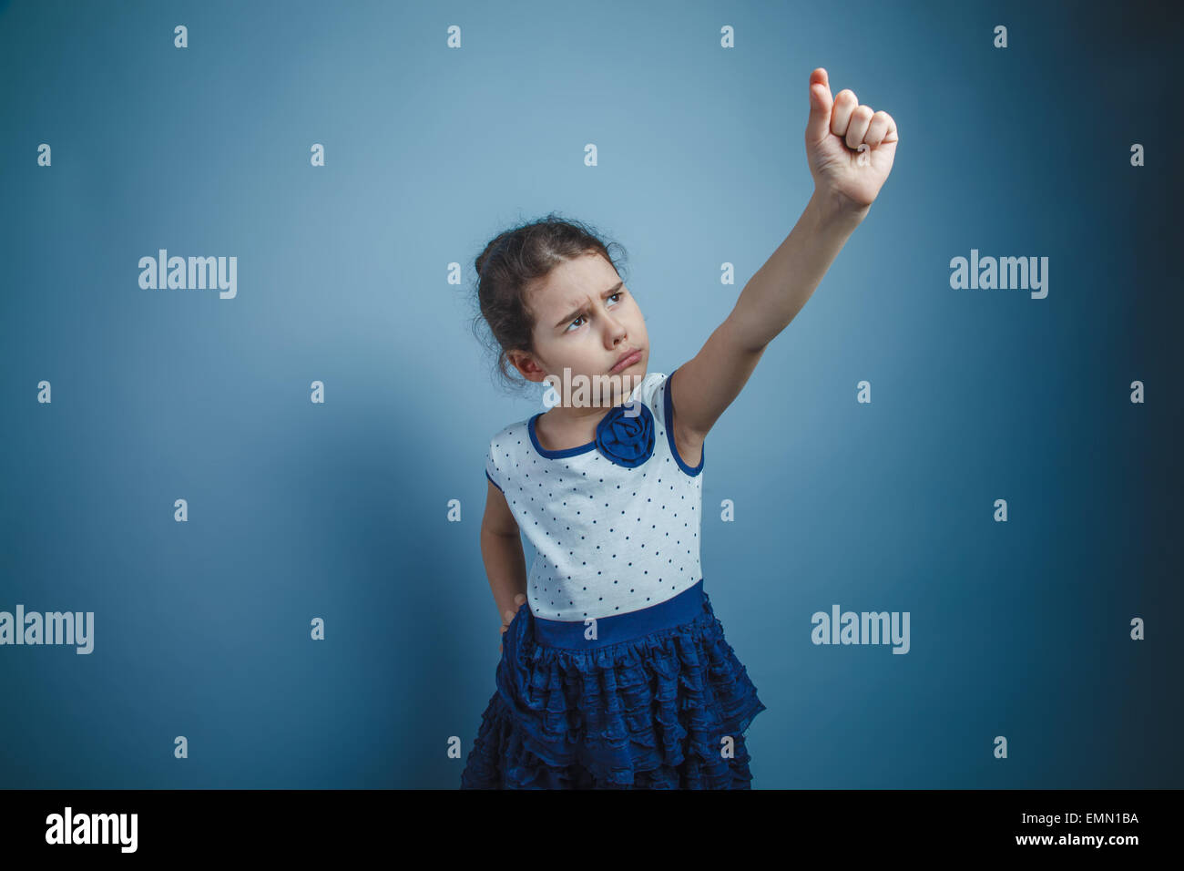 a girl of seven European appearance brunette keeps fingers hurt object ...