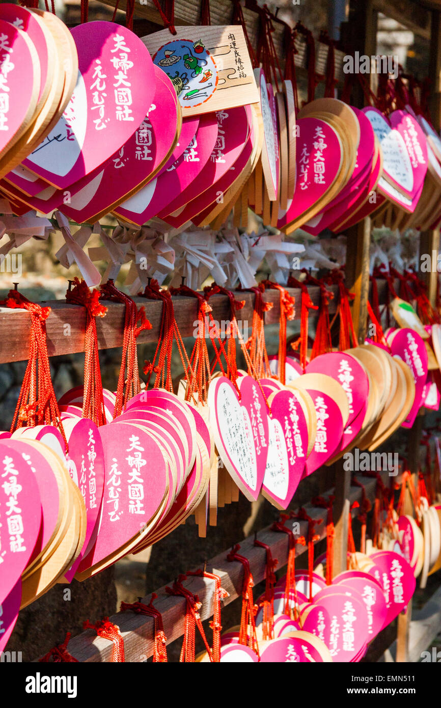 Heart shaped Japanese Ema boards hanging on frame at the Kasuga-Taisha ...