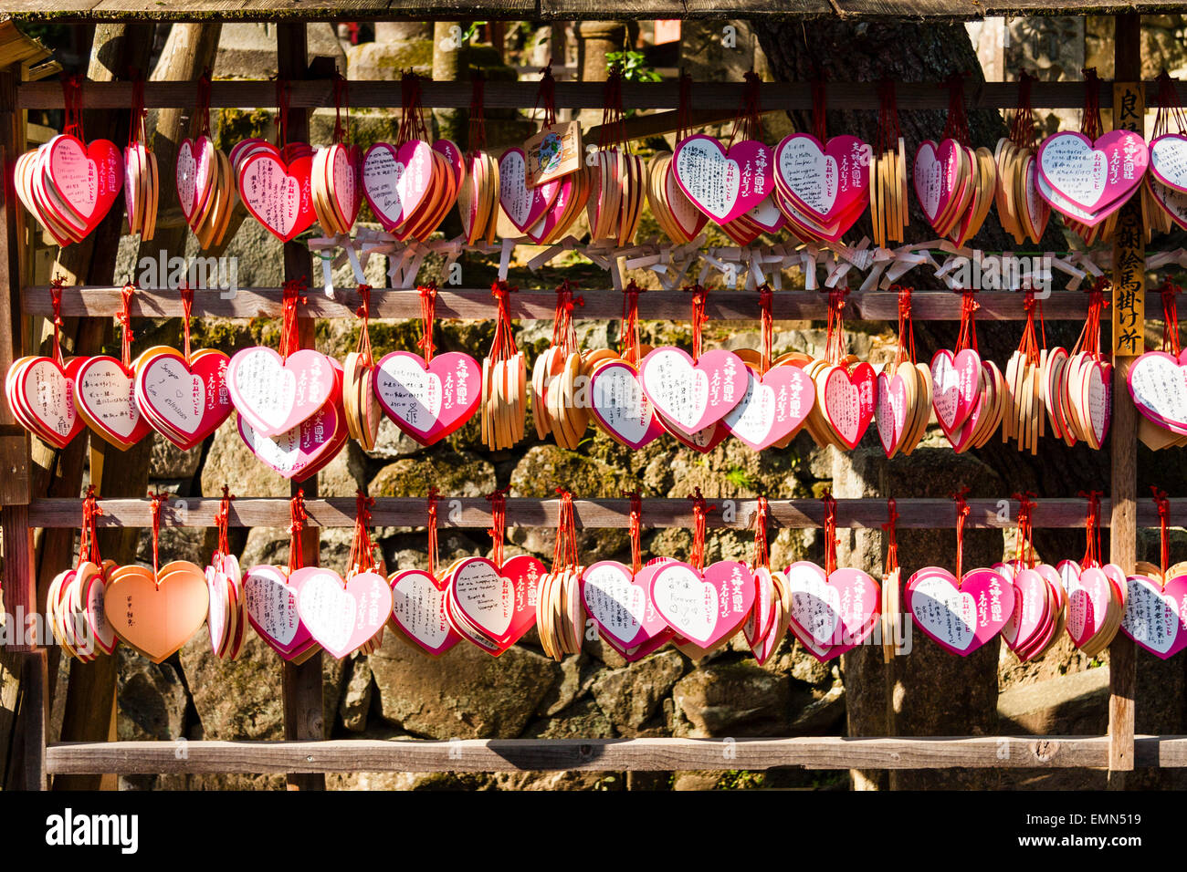 Heart shaped Japanese Ema boards hanging on frame at the Kasuga-Taisha ...