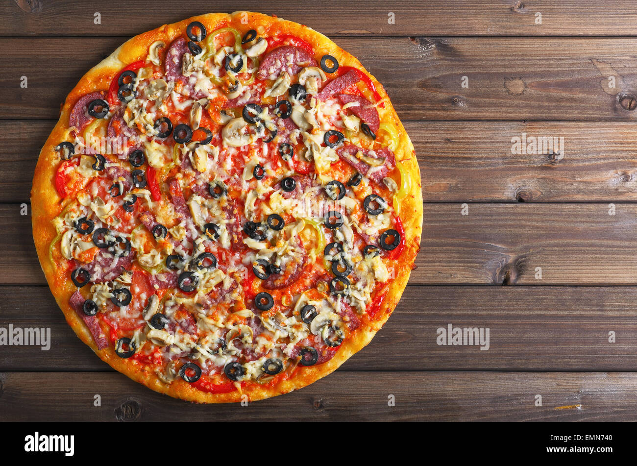 Freshly Baked Pepperoni Pizza with Black Olives, Tomatoes and Spices ...