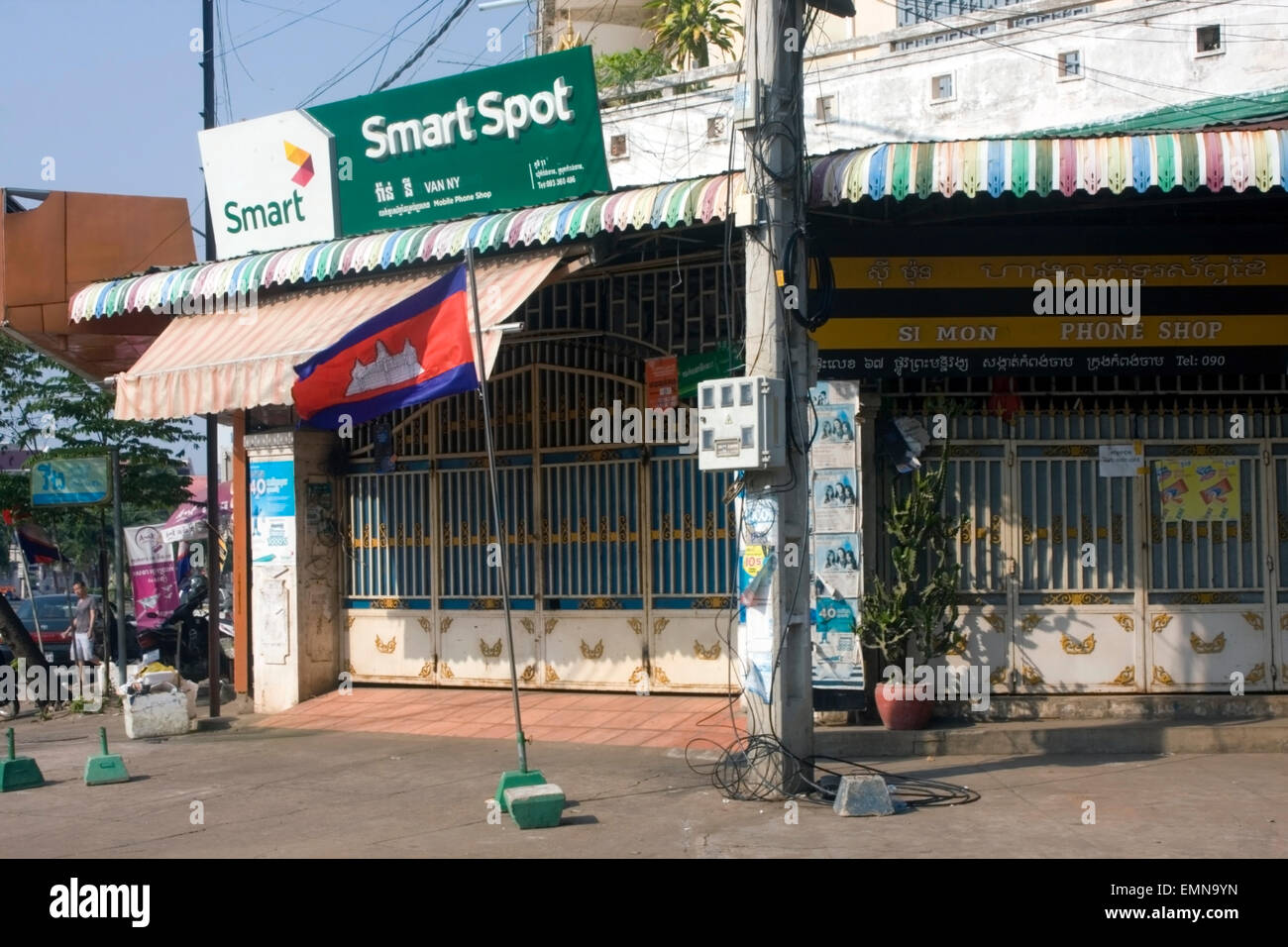 A Cambodian flag flies in front of a closed phone shop during the Khmer ...