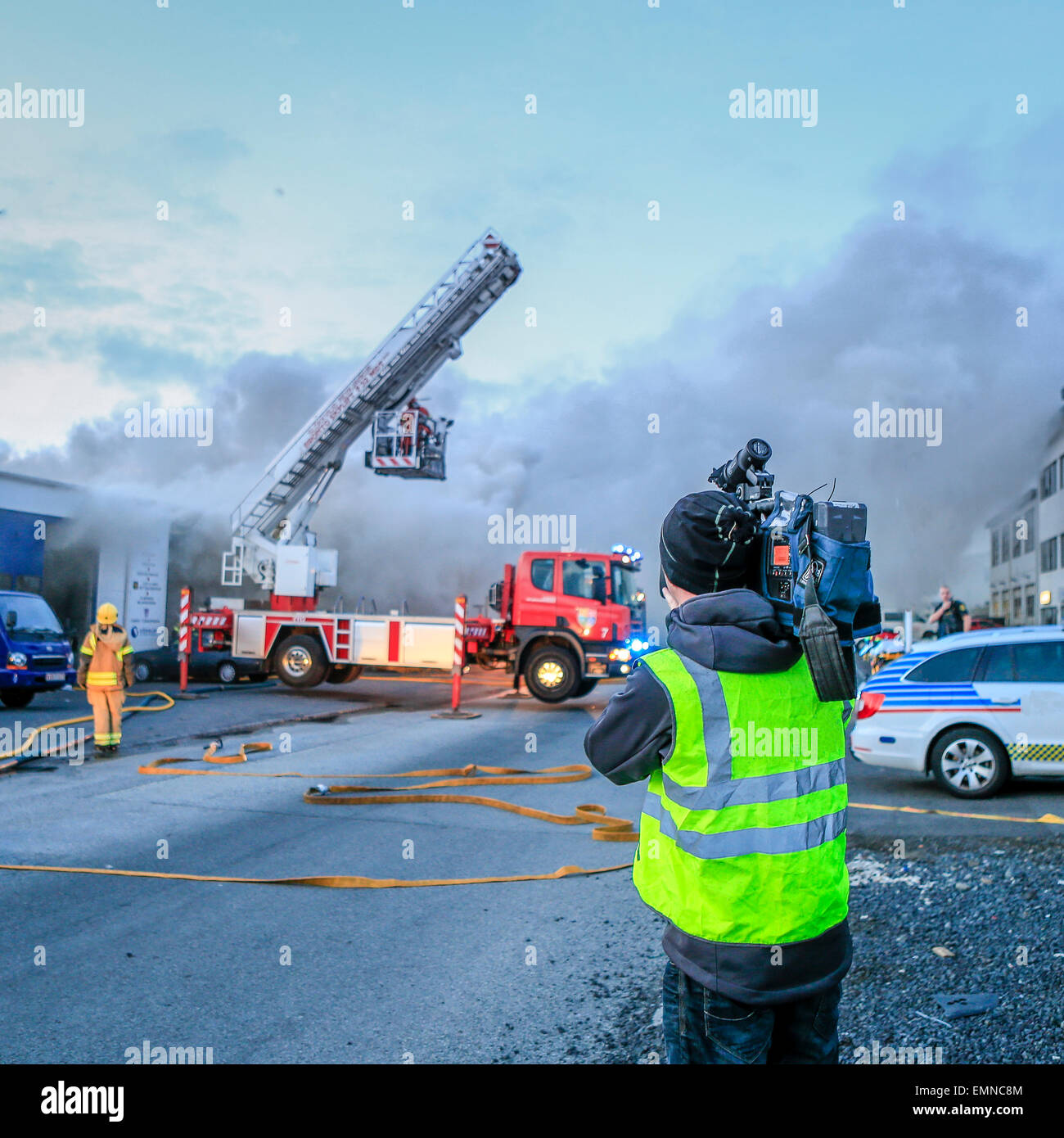 Firemen at the scene of a fire involving a small business. Kopavogur ...