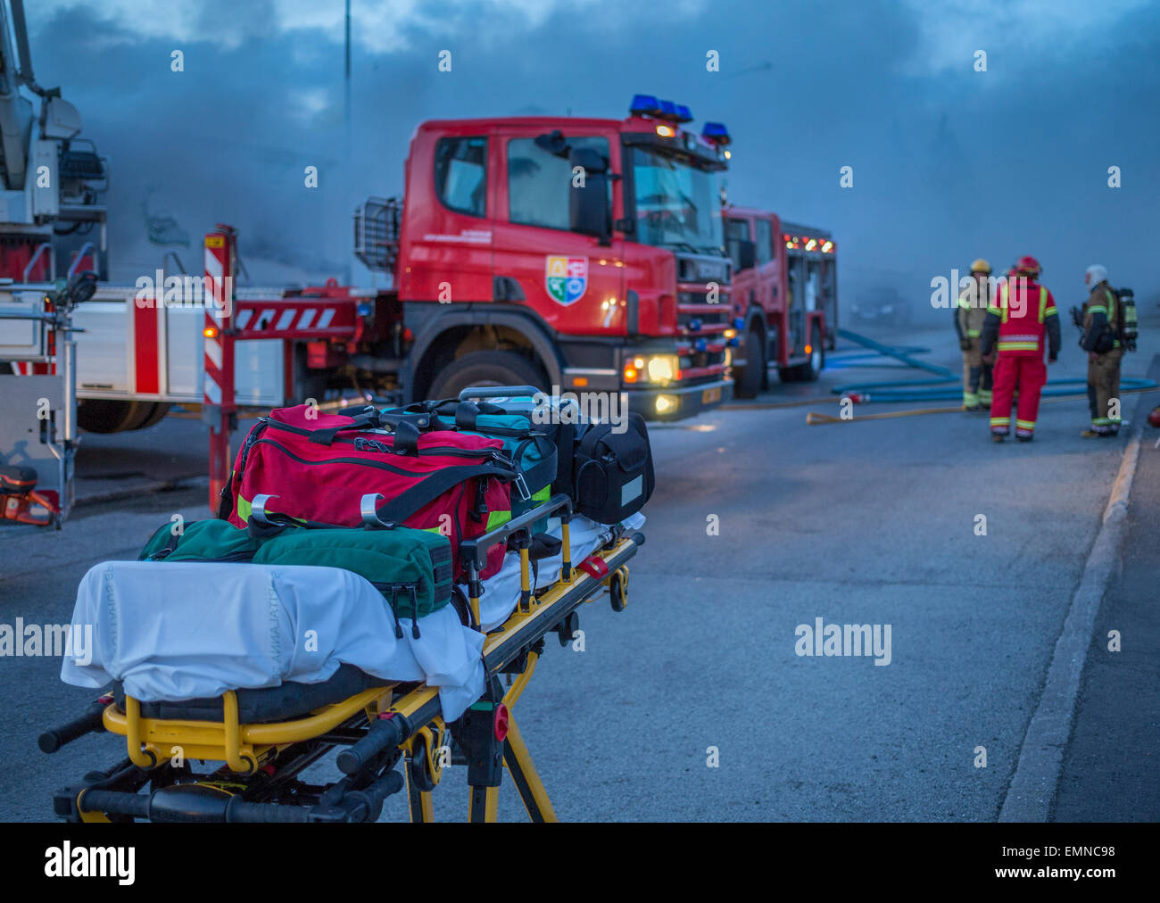 Firemen at the scene of a fire involving a small business. Kopavogur ...