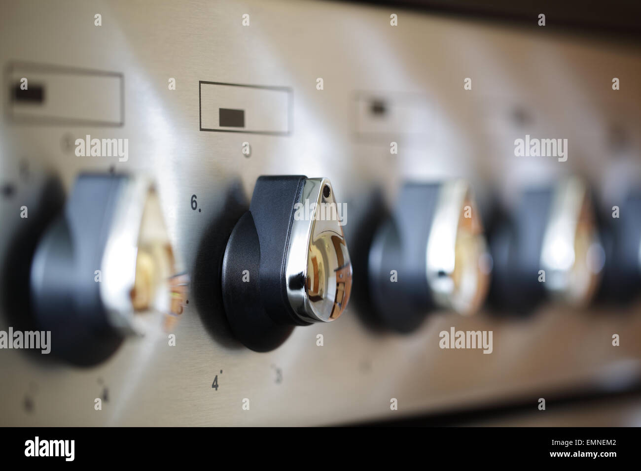 Commercial kitchen stove temperature controls Stock Photo - Alamy
