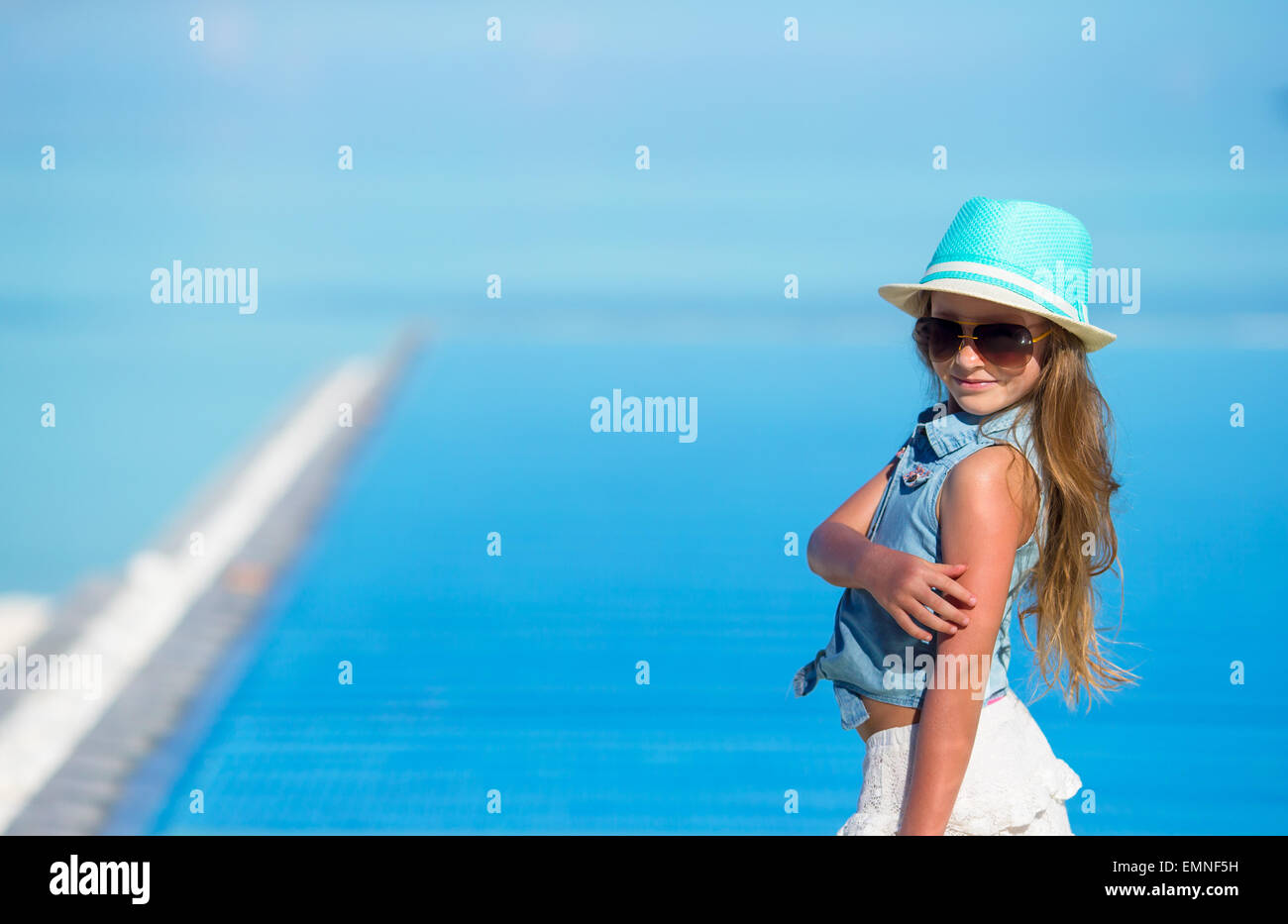 Cute girl in hat at beach during summer vacation Stock Photo - Alamy