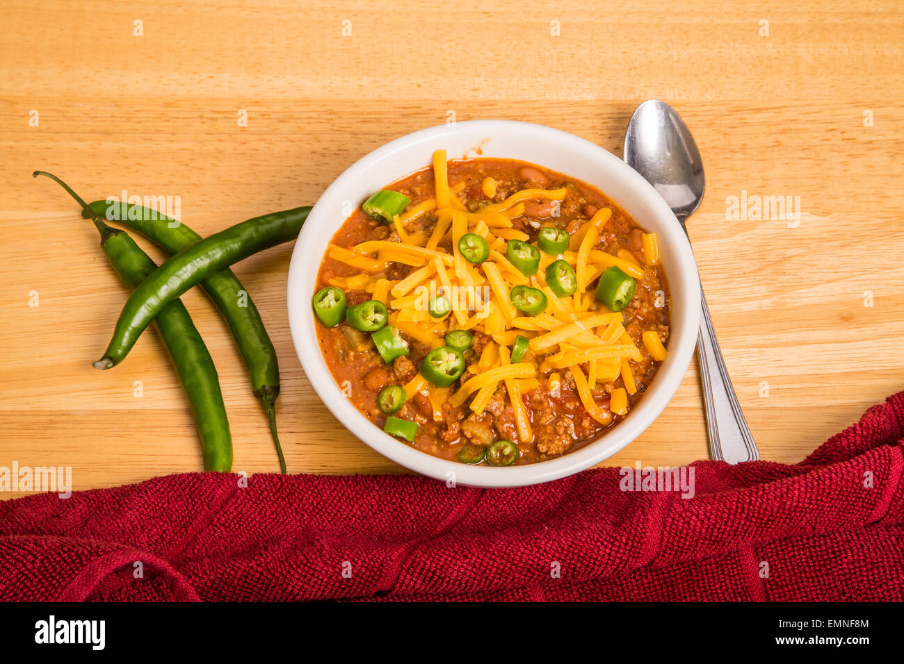 A bowl of chili con carne with beans and green chili peppers Stock ...