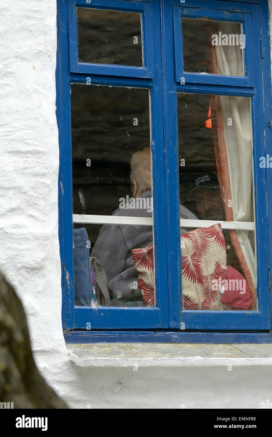 People sitting inside the Blue Peter Inn drinking in Polperro, Cornwall ...