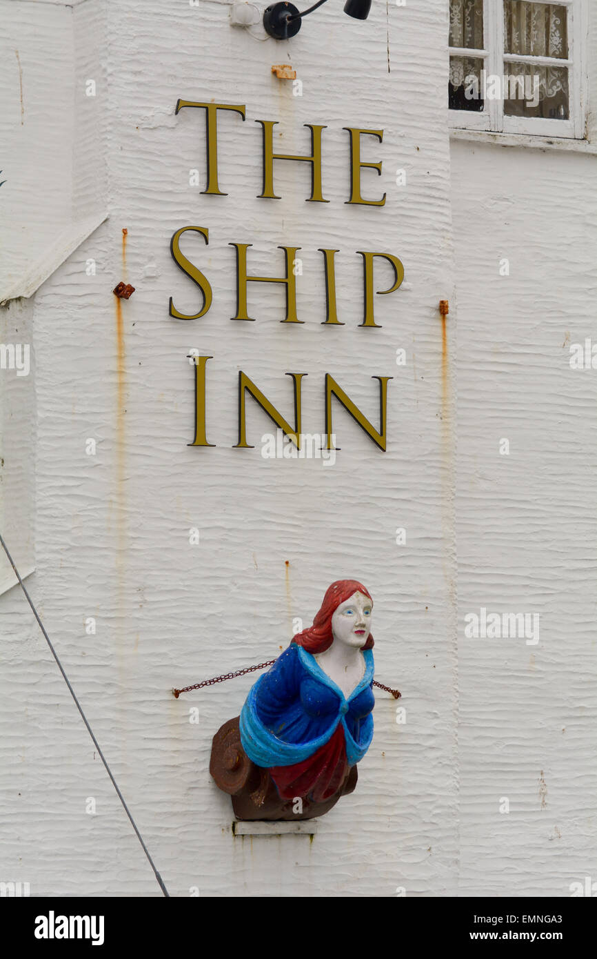 The Ship Inn with lady ship figurehead on wall in Polperro, Cornwall ...