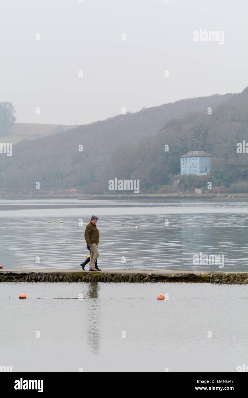 Man and woman crossing the walkway at the Mill Pool boating pond in ...
