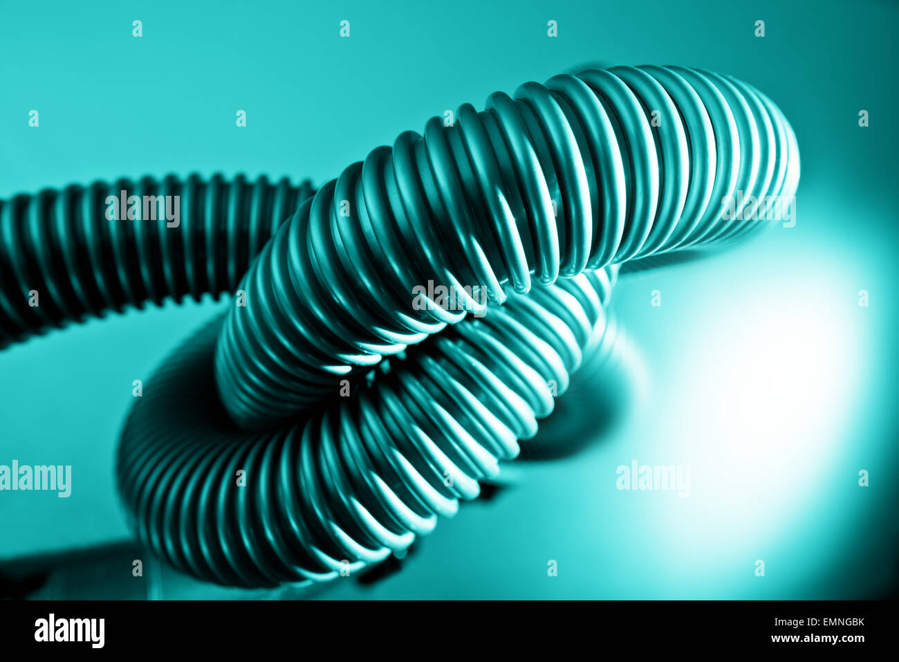a detail of plastic tube on the green background Stock Photo - Alamy