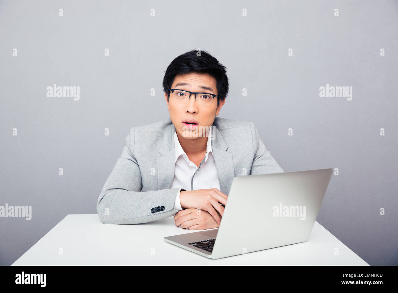 Shocked young businessman desk hi-res stock photography and images - Alamy