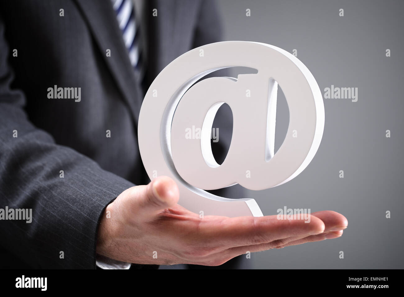 Businessman holding email at symbol concept for internet, contact and e ...