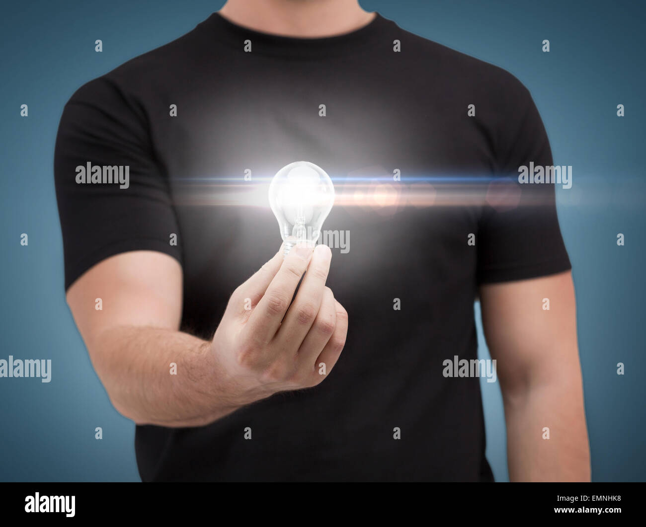 close up of man holding light bulb Stock Photo - Alamy