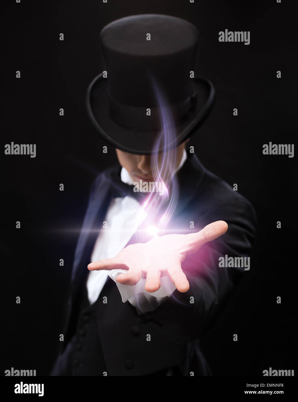 magician holding something on palm of his hand Stock Photo - Alamy