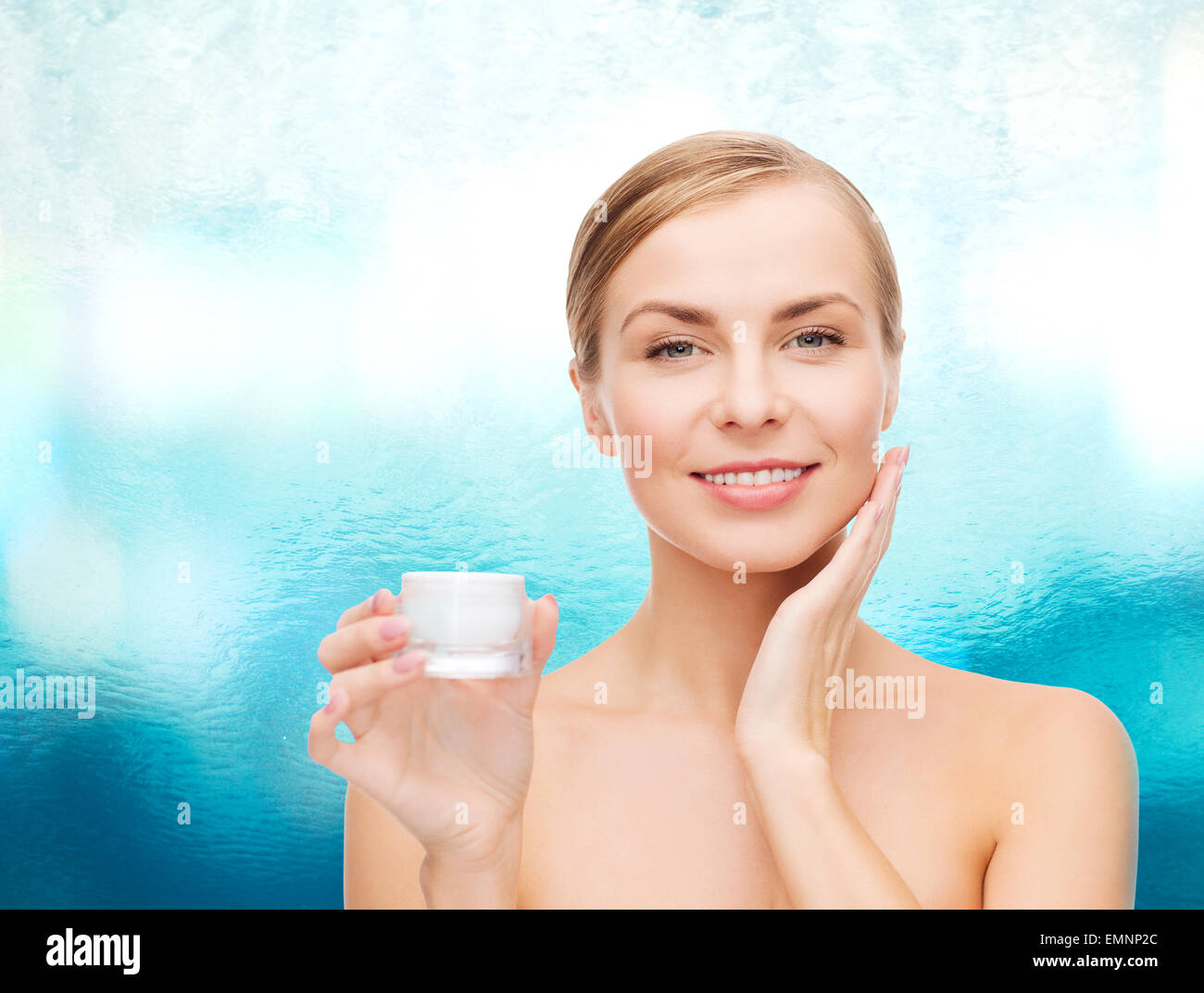 woman applying cream on her skin Stock Photo - Alamy