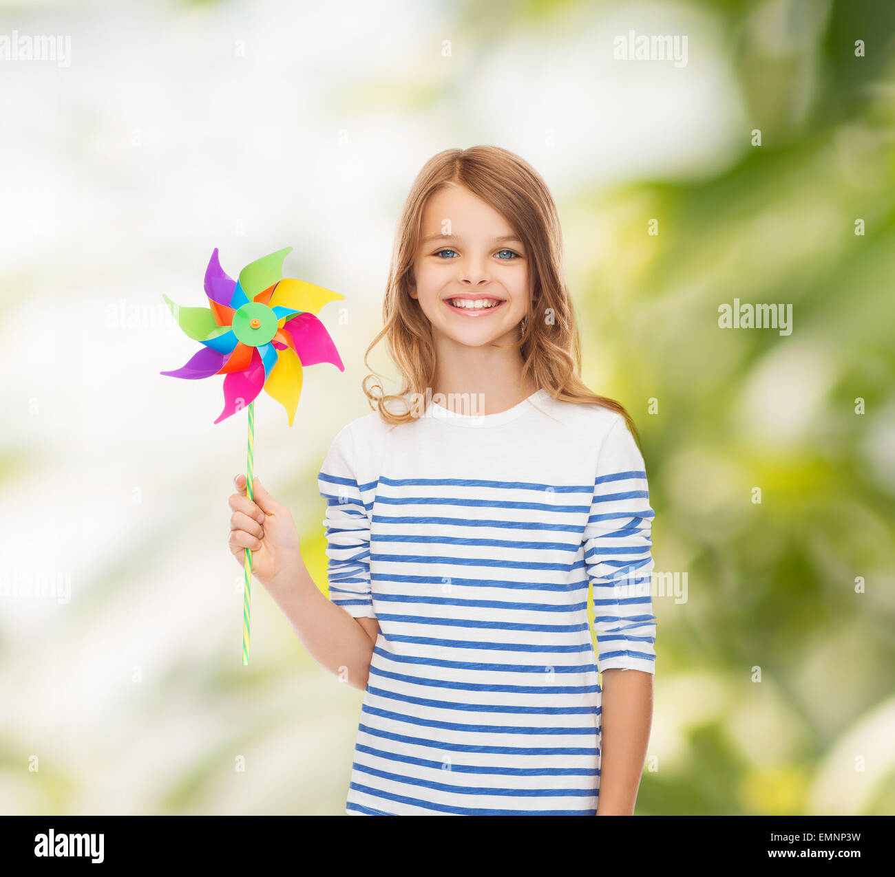 smiling child with colorful windmill toy Stock Photo - Alamy