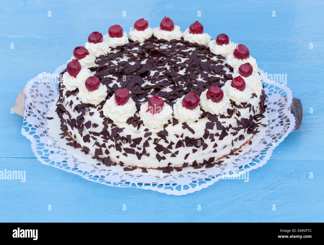 Black Forest cake on blue wood Stock Photo - Alamy