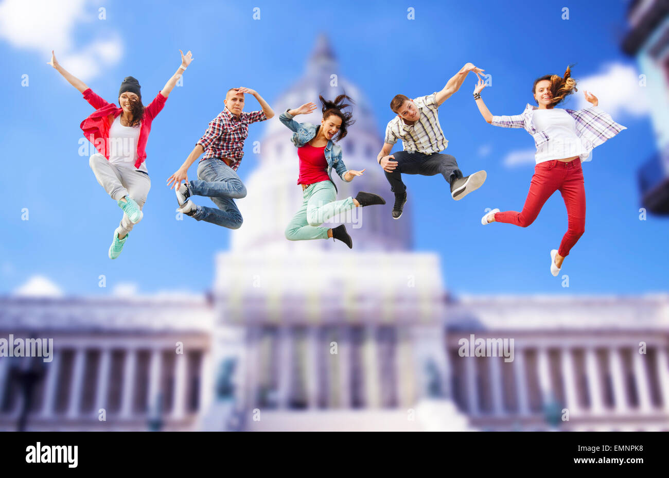 group of teenagers jumping Stock Photo - Alamy