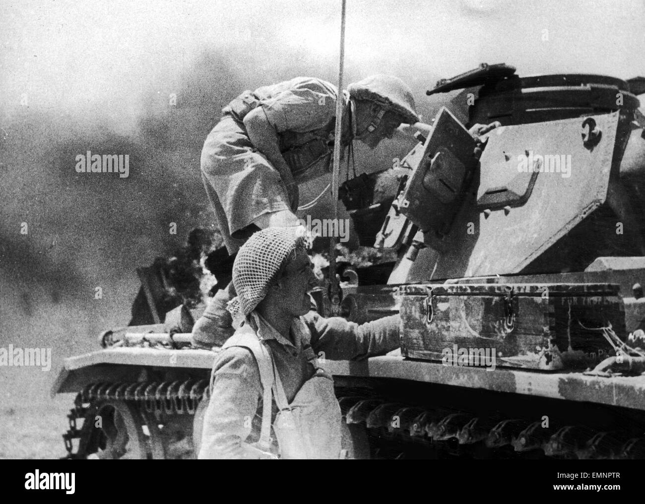 Soldiers from the 8th Army seen here examining a derelict German tank ...