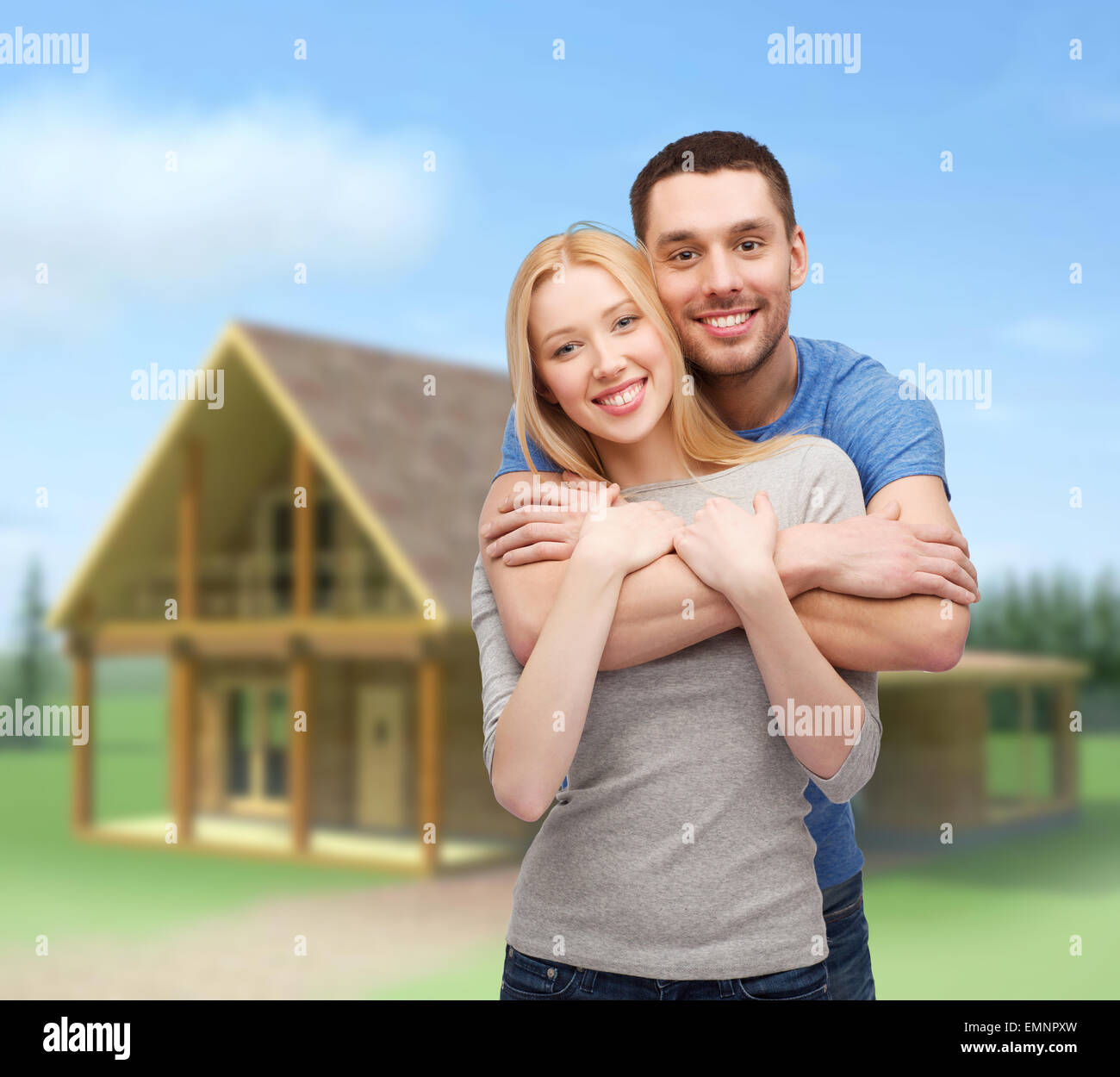 smiling couple hugging Stock Photo - Alamy