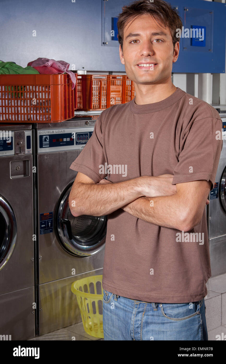 Man in the laundry Stock Photo - Alamy