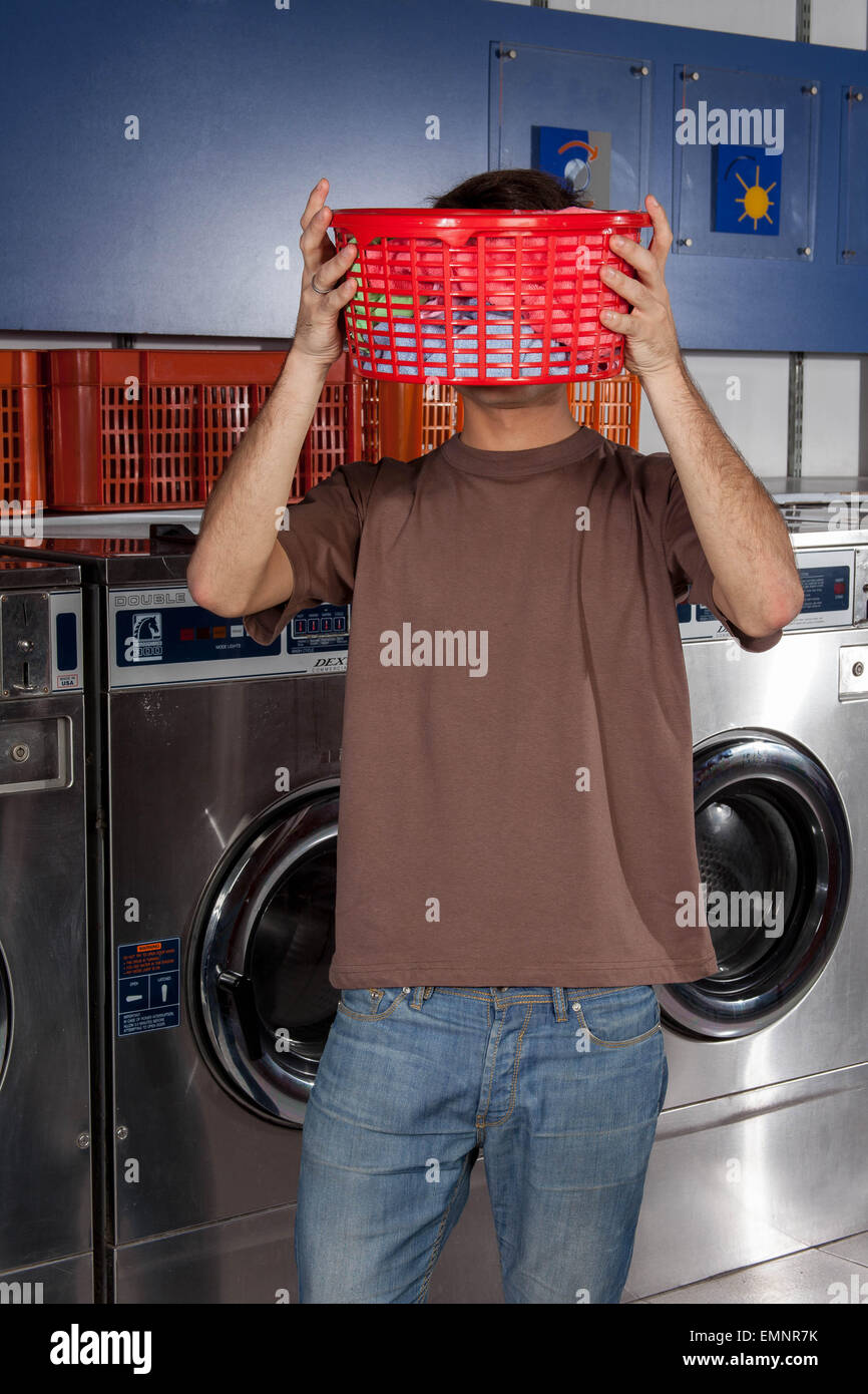 Man in the laundry Stock Photo - Alamy