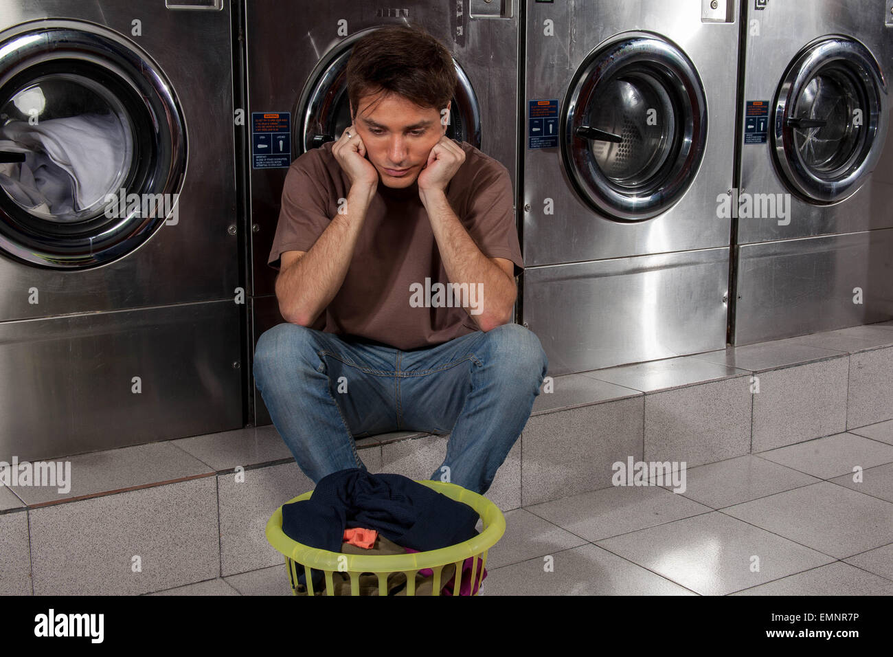 Man in the laundry Stock Photo - Alamy
