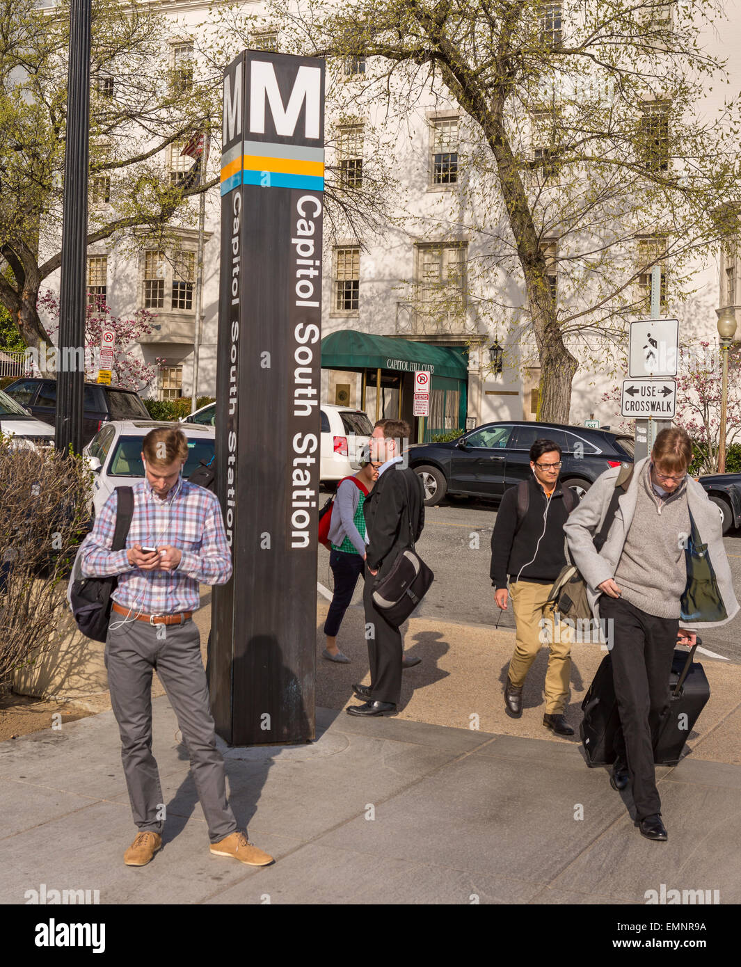 WASHINGTON, DC, USA - Capitol South Metro station sign and people, on ...