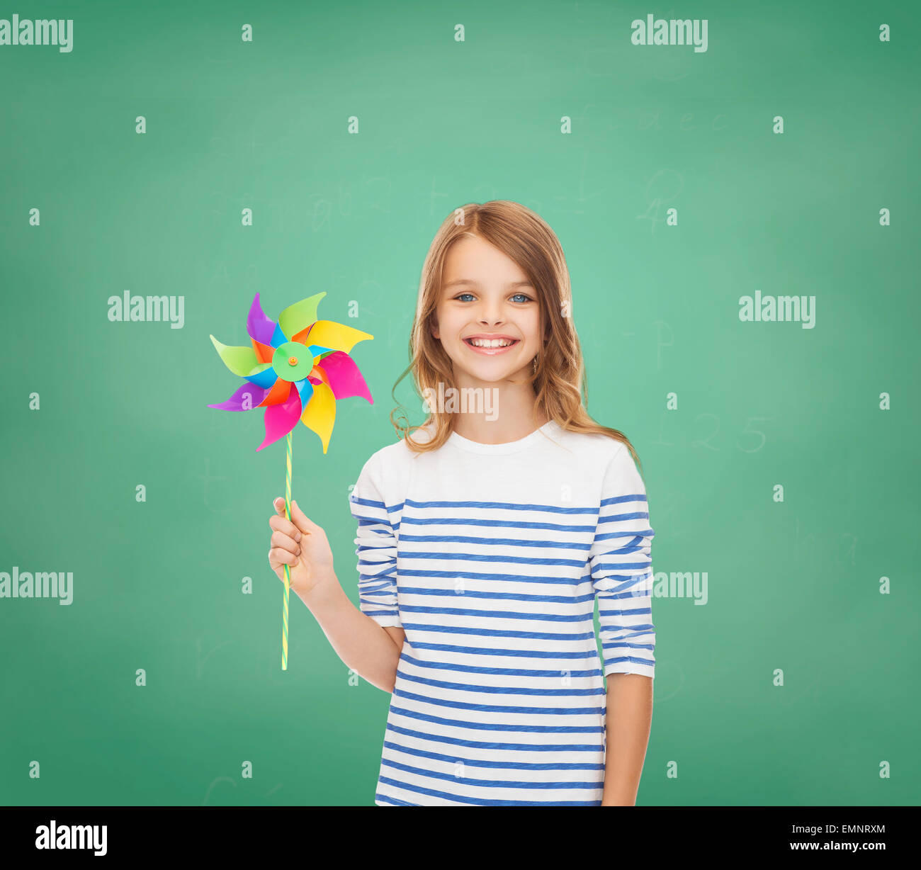 smiling child with colorful windmill toy Stock Photo - Alamy
