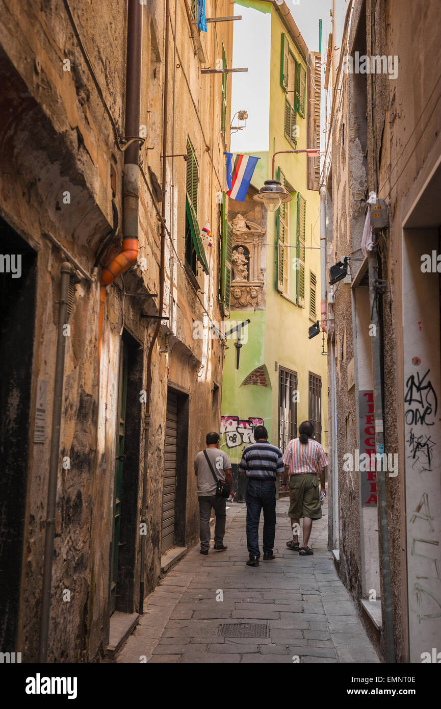 Genoa alley, view of a typical narrow street in the medieval center of ...