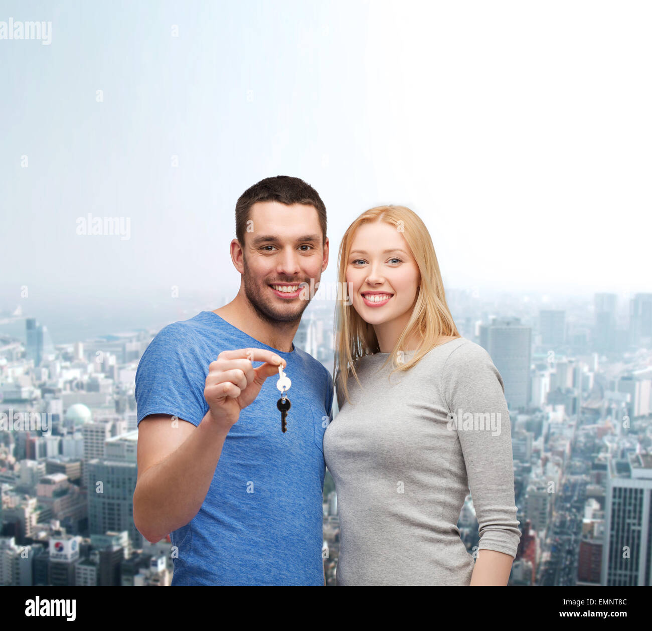 smiling couple holding keys Stock Photo - Alamy