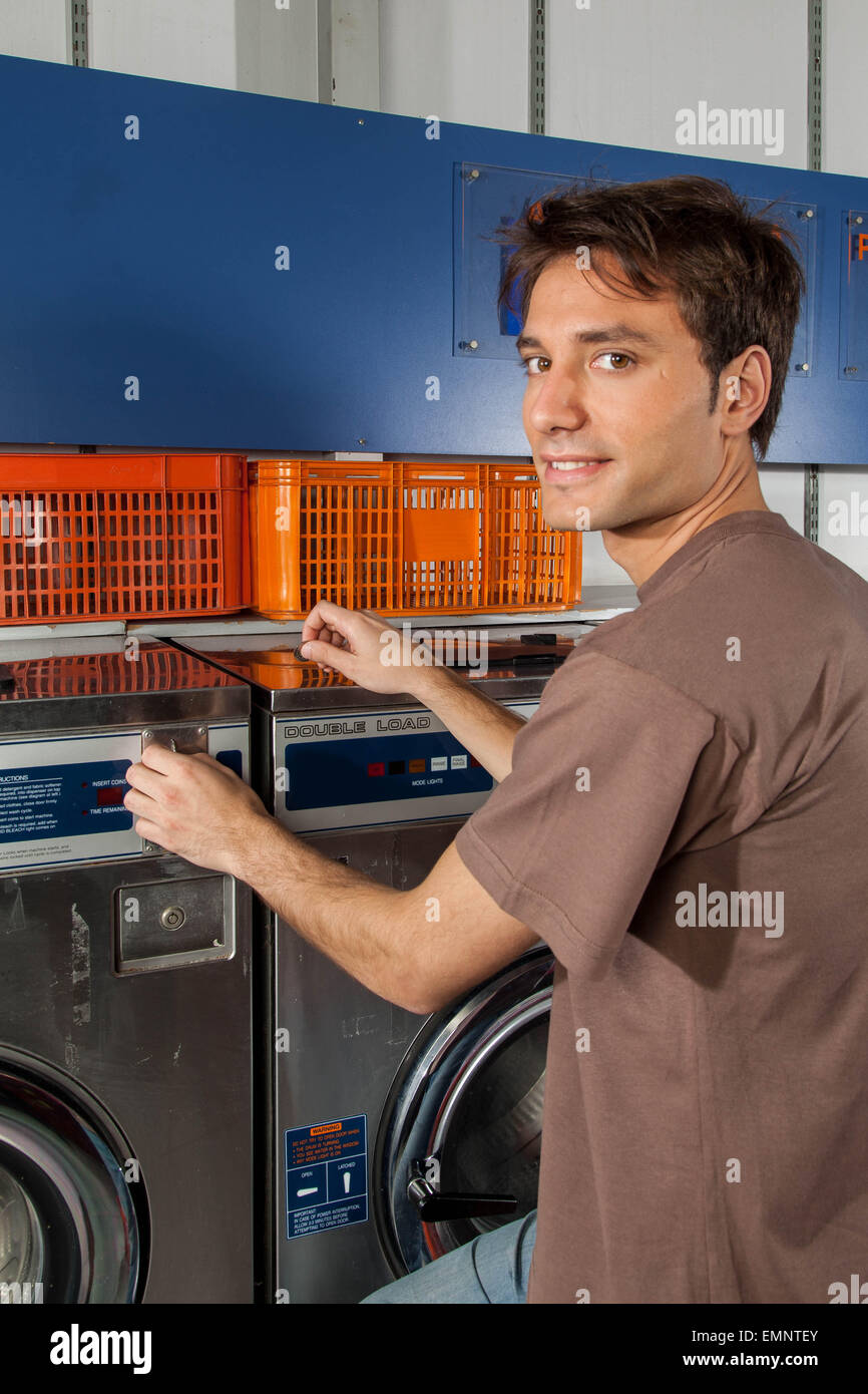 Man in the laundry Stock Photo - Alamy