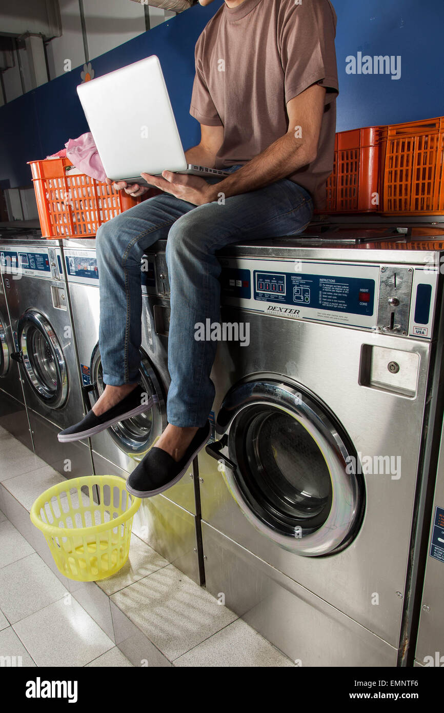Man in the laundry Stock Photo - Alamy