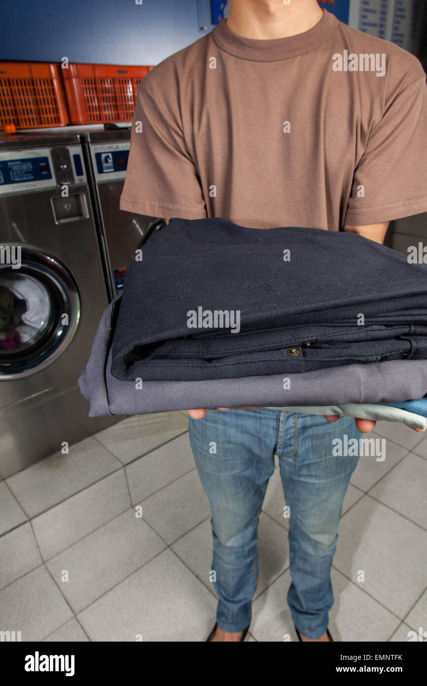 Man in the laundry Stock Photo - Alamy