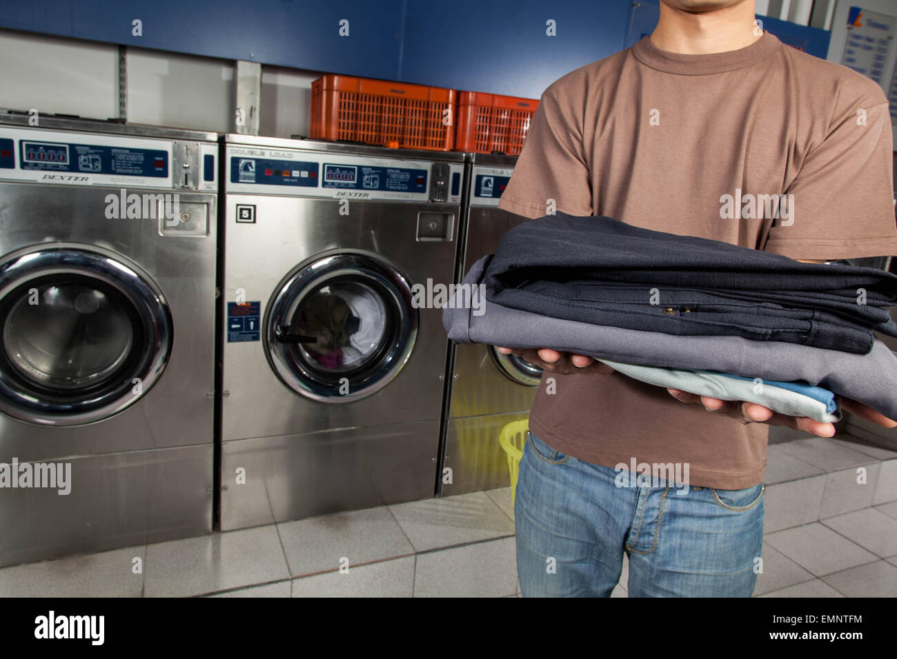 Man in the laundry Stock Photo - Alamy