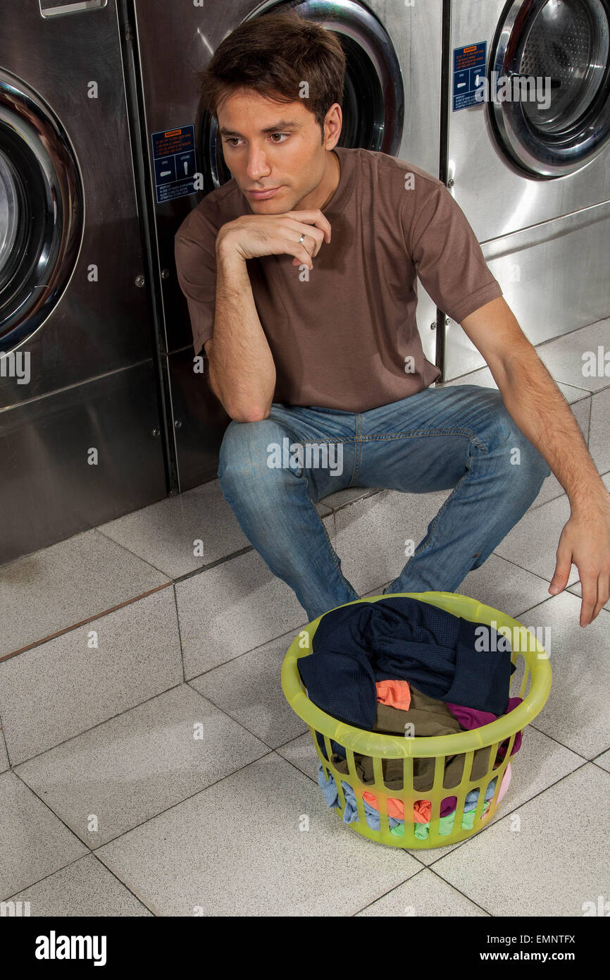 Man in the laundry Stock Photo - Alamy