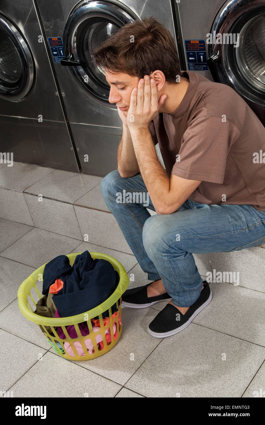 Man in the laundry Stock Photo - Alamy