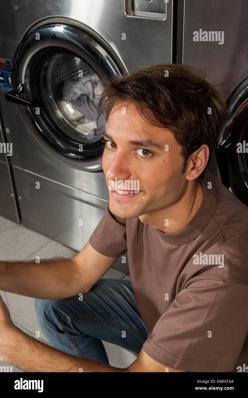 Man in the laundry Stock Photo - Alamy