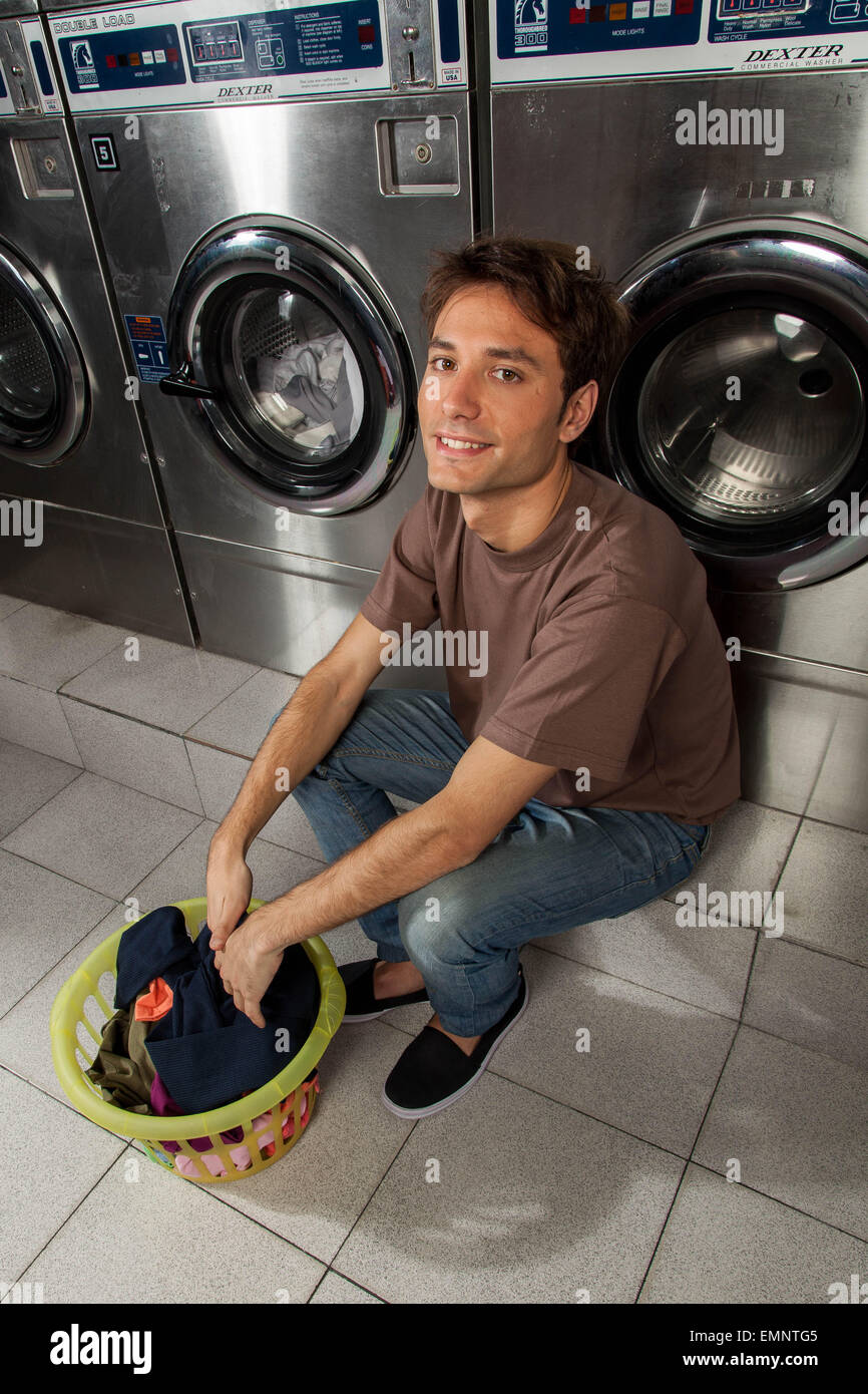 Man in the laundry Stock Photo - Alamy