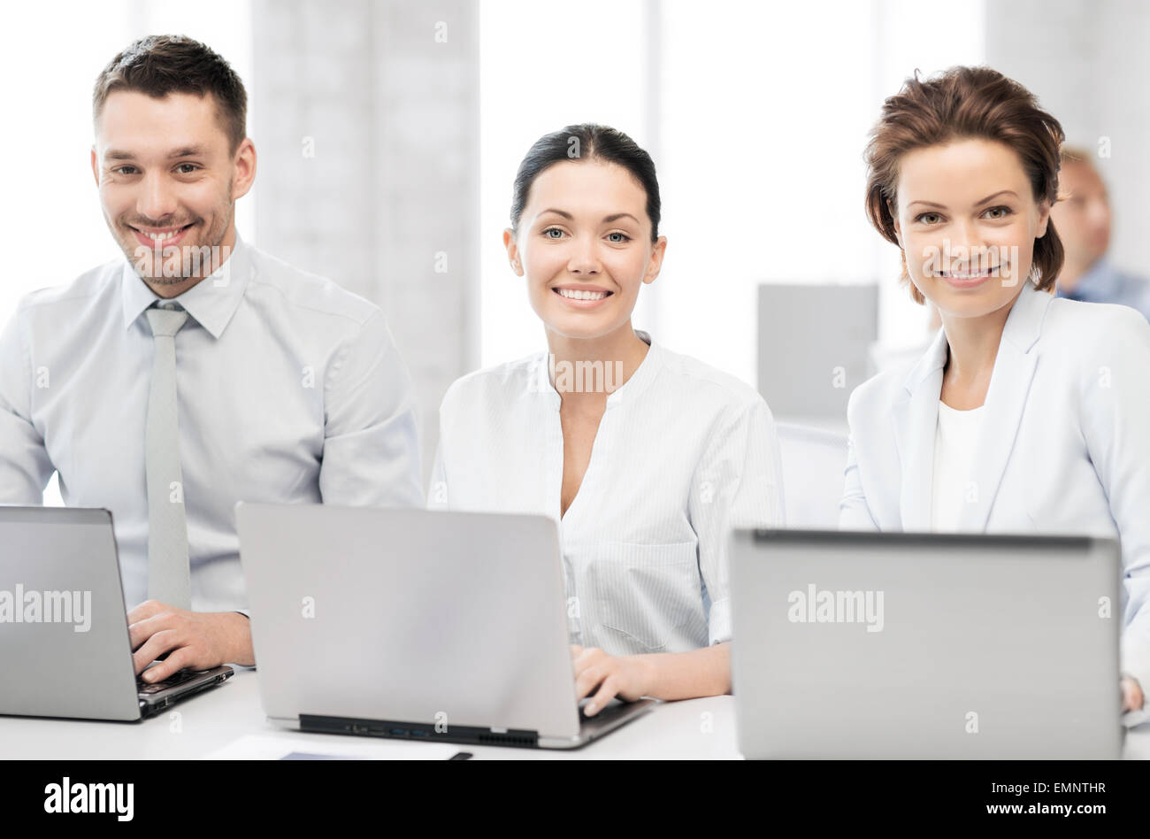 group of people working with laptops in office Stock Photo - Alamy