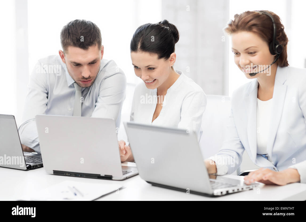 group of people working with laptops in office Stock Photo - Alamy