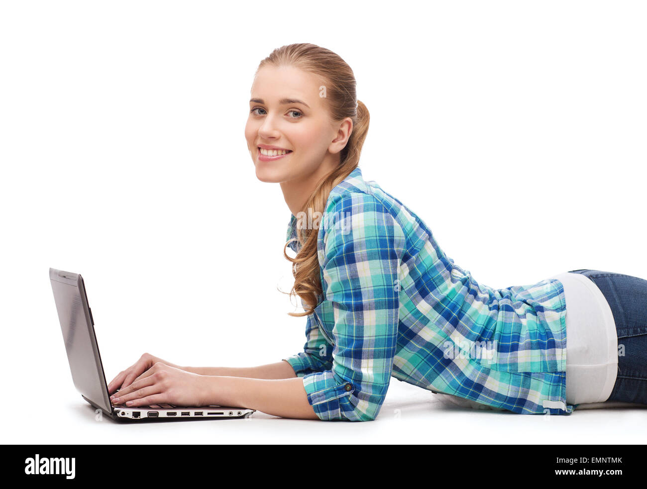 smiling woman with laptop computer lying on floor Stock Photo - Alamy
