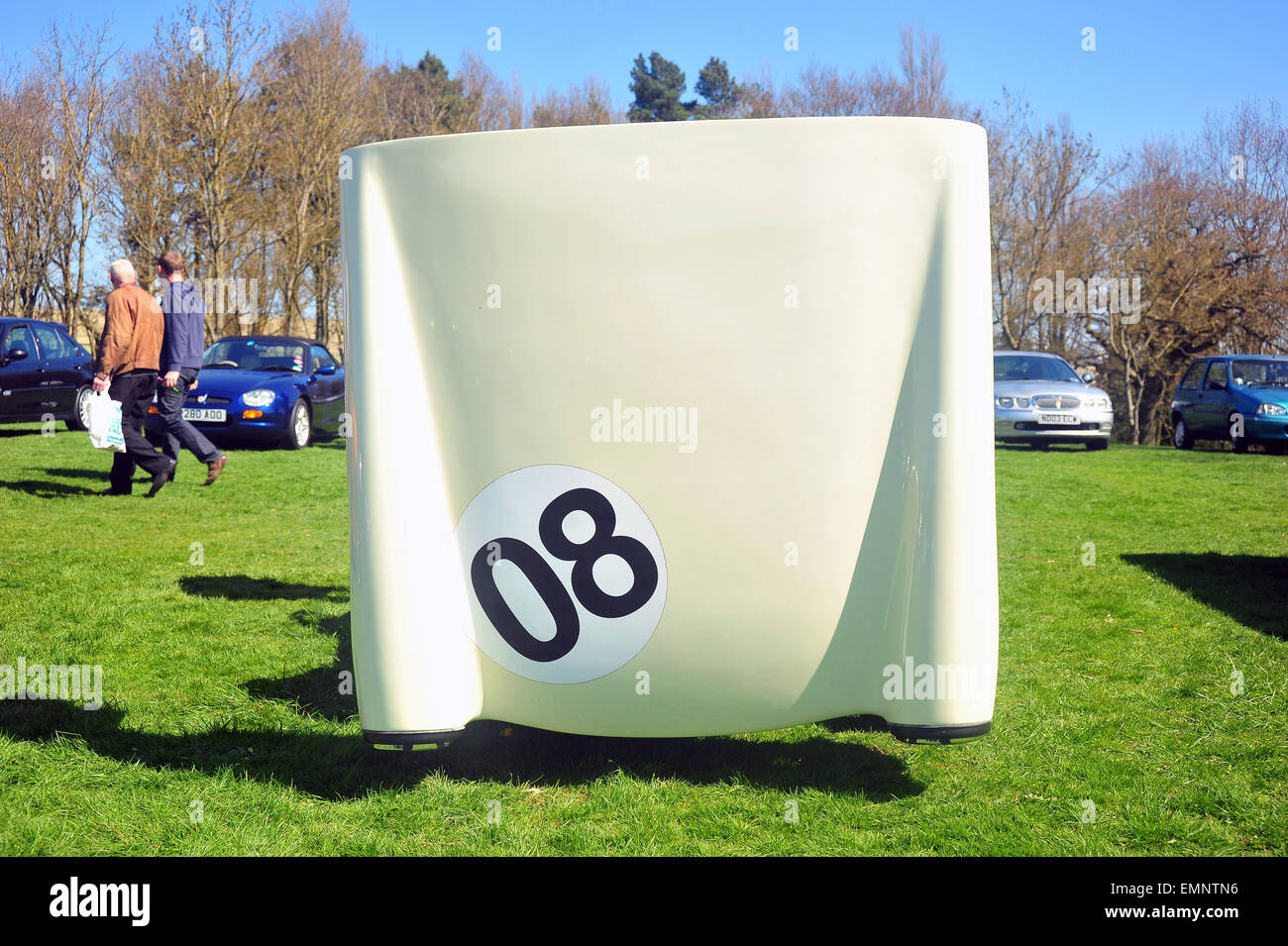 The front view of an open bonnet with a number eight decal on it at a ...