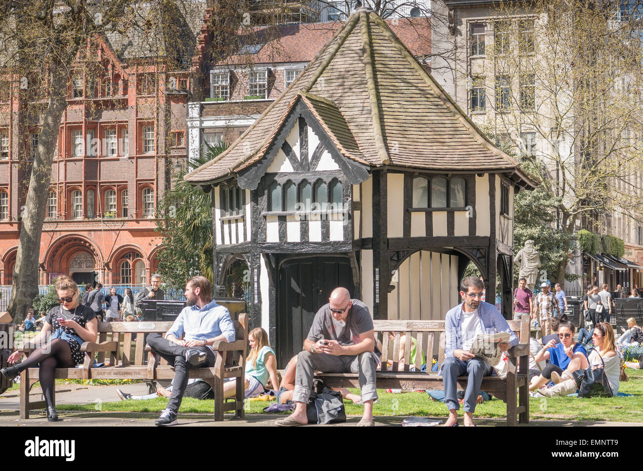 Benches at Soho Square, London, a popular lunchtime venue for workers ...