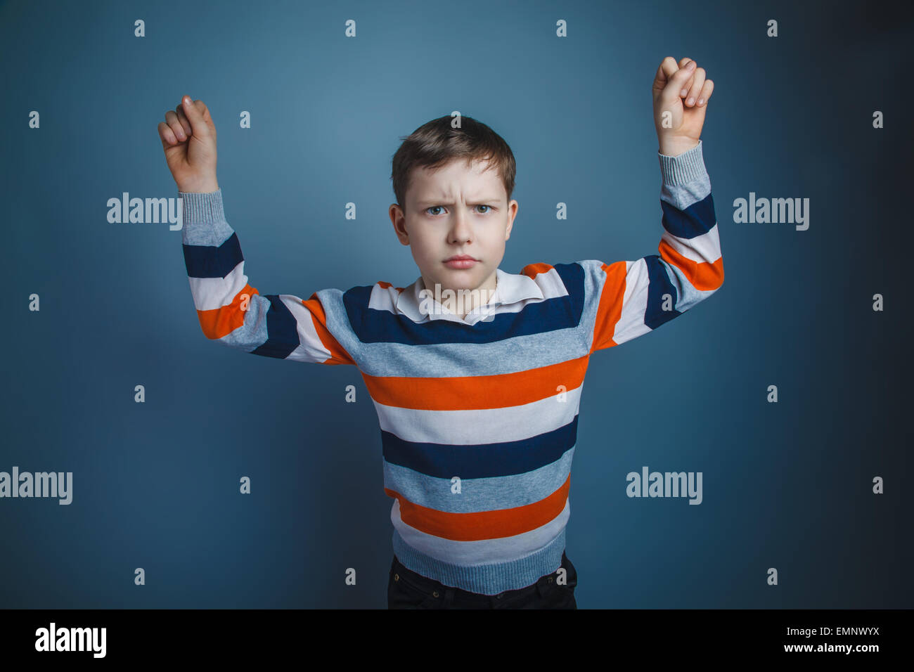 teenager boy of about ten European appearance Brown frowned holding ...
