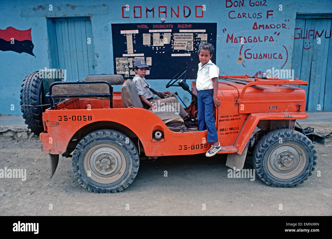 Boy soldier and child in local militia jeep in Santa Maria, a small ...